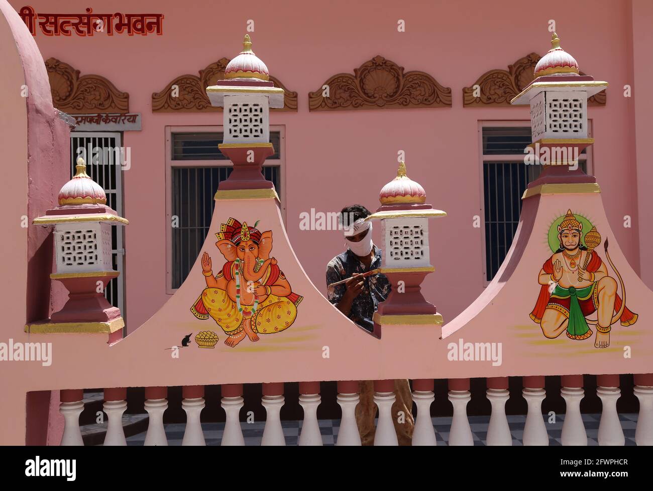 Beawar, Rajasthan, India, May 24, 2021: Artist decorate a wall with ...