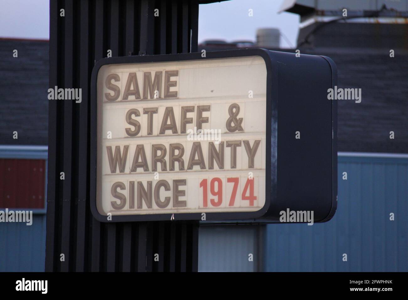 old fashioned sign boasting long time staff and never changing service ...