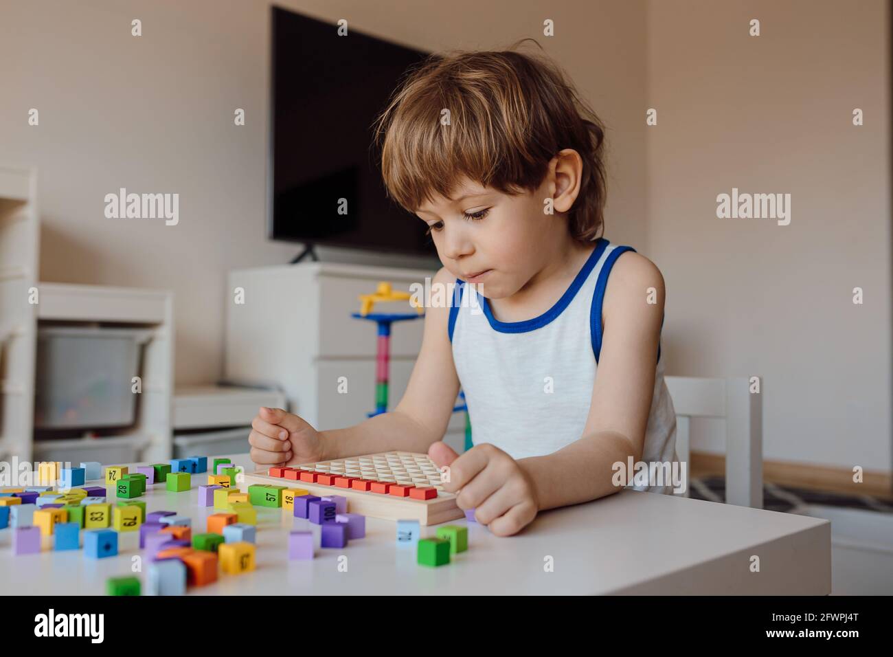 3 year old boy is immersed in his own world. Child obsession with ...