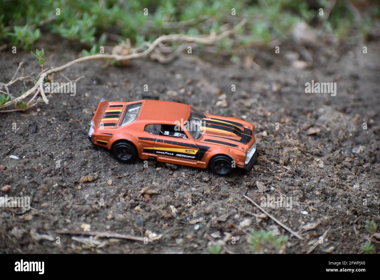 A tiny car parked on the roadside Stock Photo - Alamy