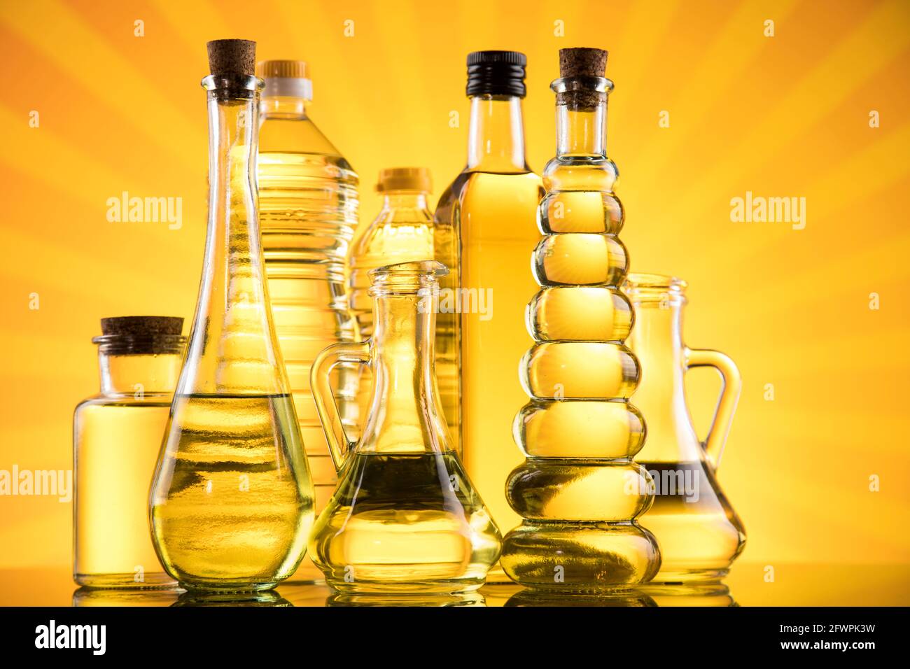 Olive oil bottles, olive branch and Cooking oils Stock Photo - Alamy