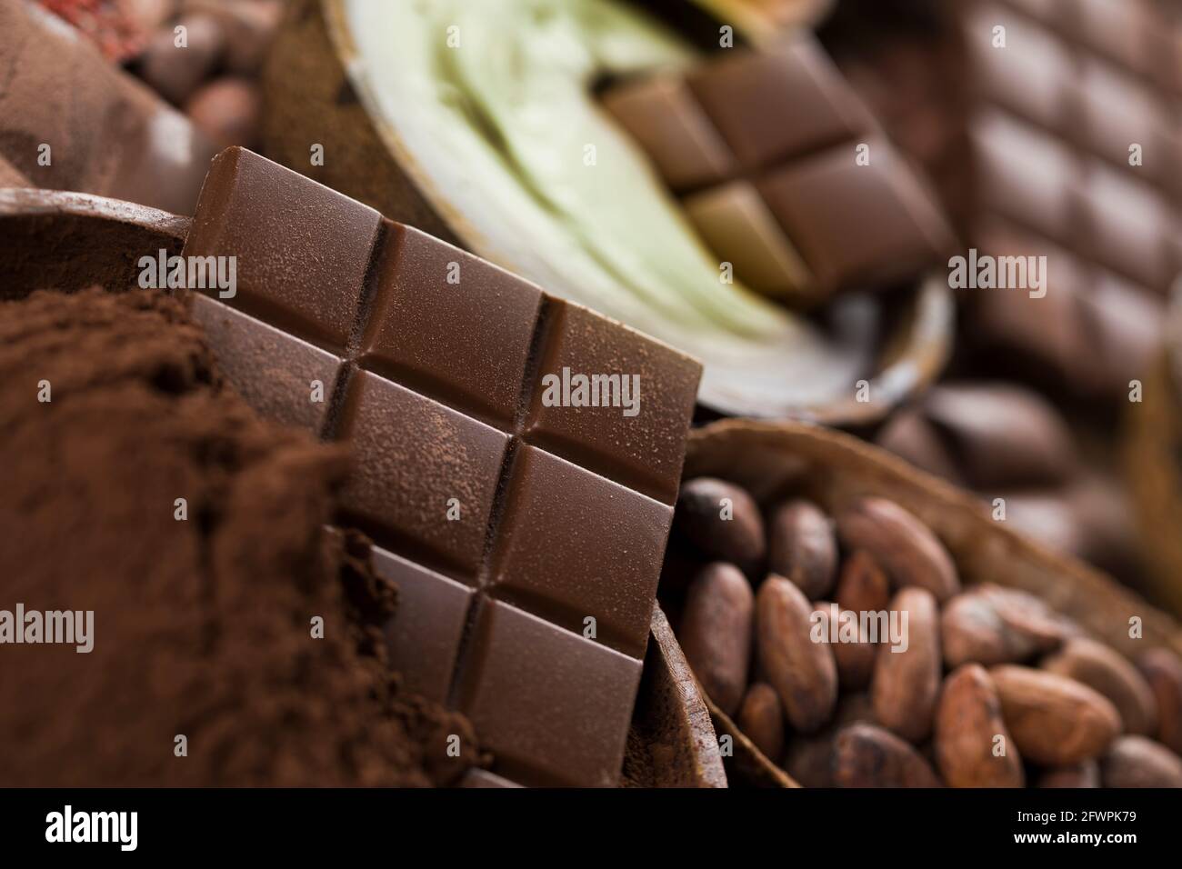 Chocolate bar, candy sweet, cacao beans and powder Stock Photo - Alamy