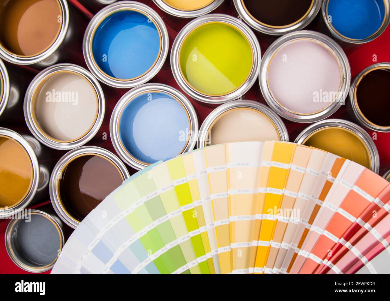 Tin cans with paint, brushes and bright palette of colors Stock Photo ...