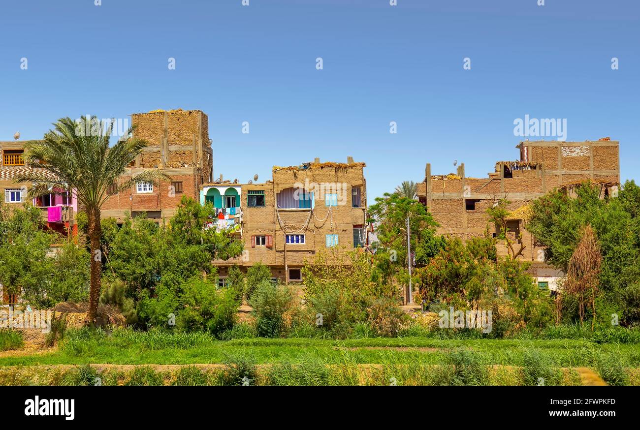 Poor buildings on the Nile canal near Qena, Egypt Stock Photo - Alamy