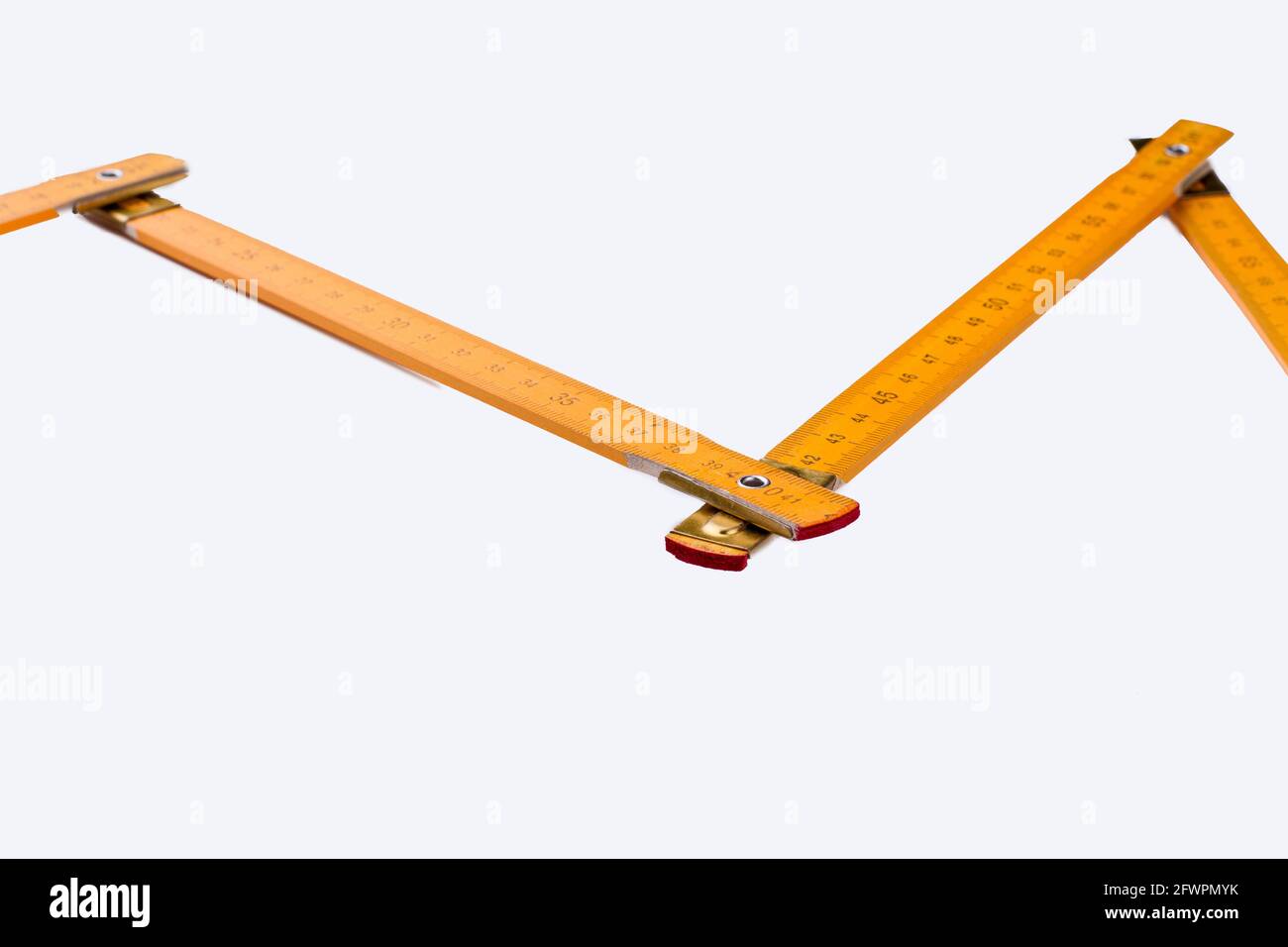 Yellow wooden ruler isolated on white background Stock Photo - Alamy
