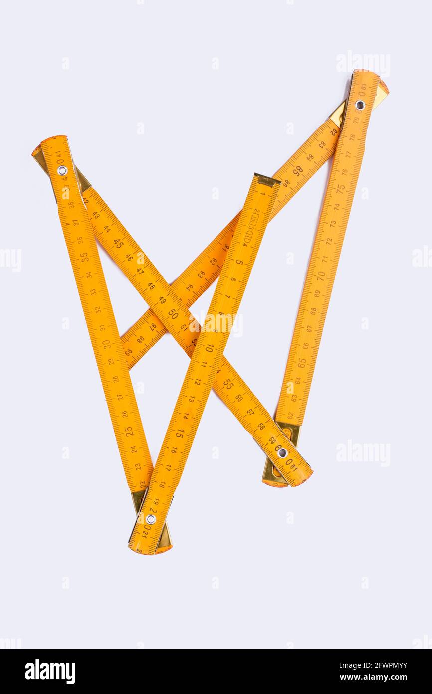 Carpenter folding ruler. Isolated on white background Stock Photo - Alamy