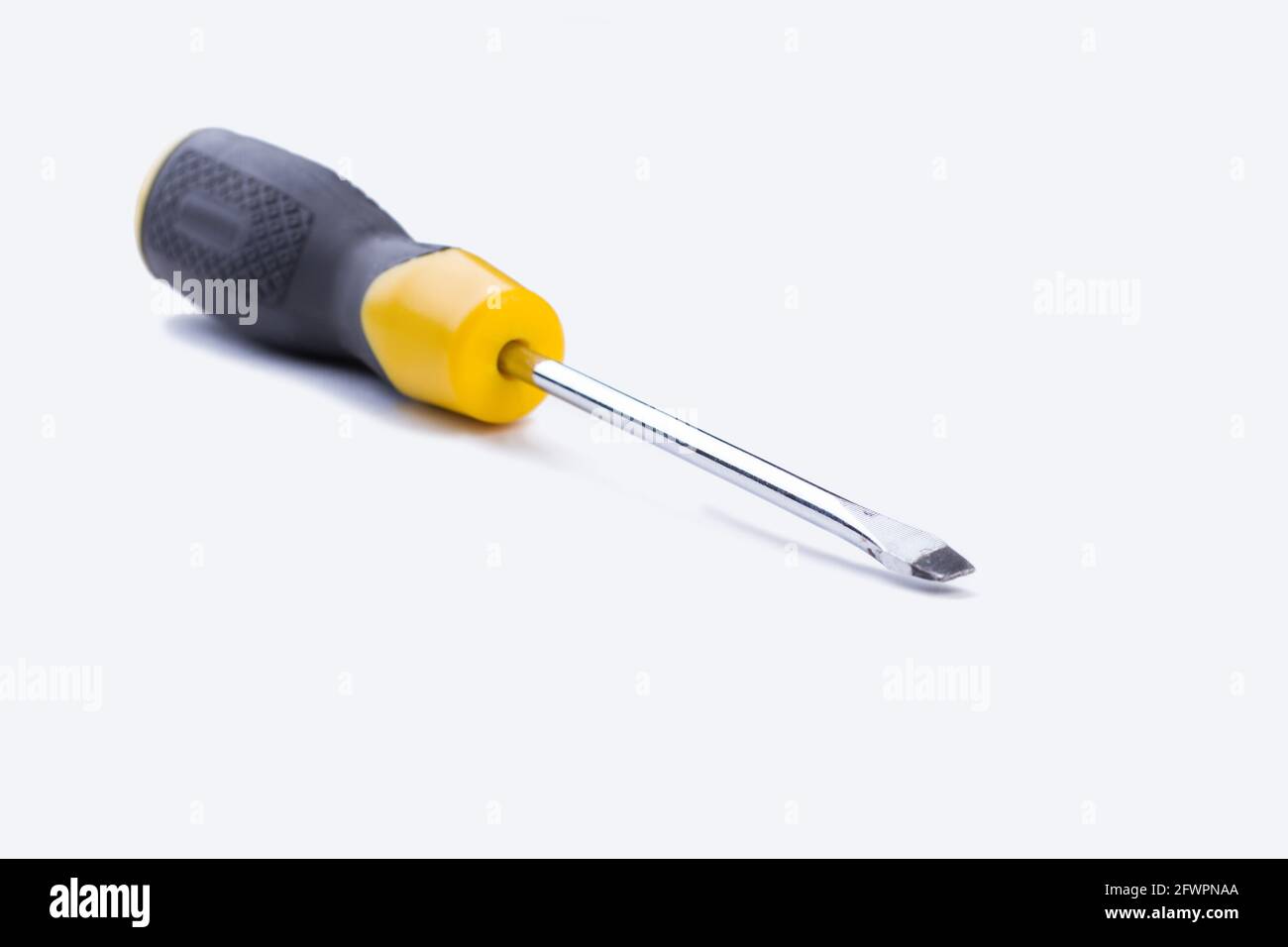 Screwdriver with rubber handle on white background Stock Photo - Alamy