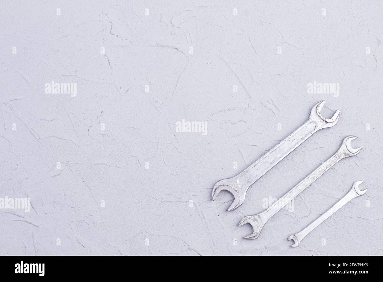 Mechanic tools on gray textured background Stock Photo - Alamy