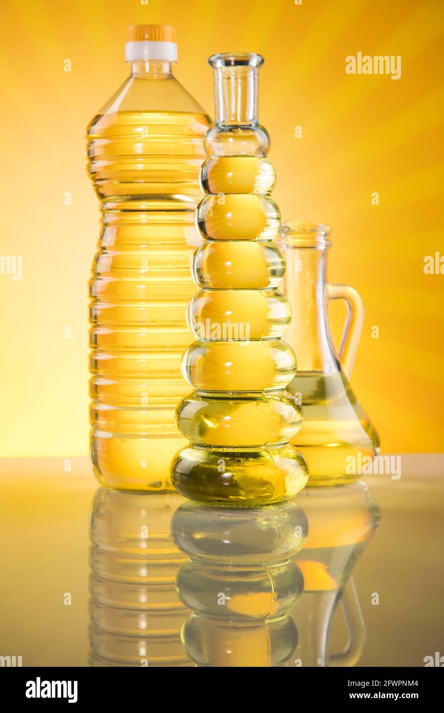 Bottles of olive oil, olive branch and Cooking oils Stock Photo - Alamy