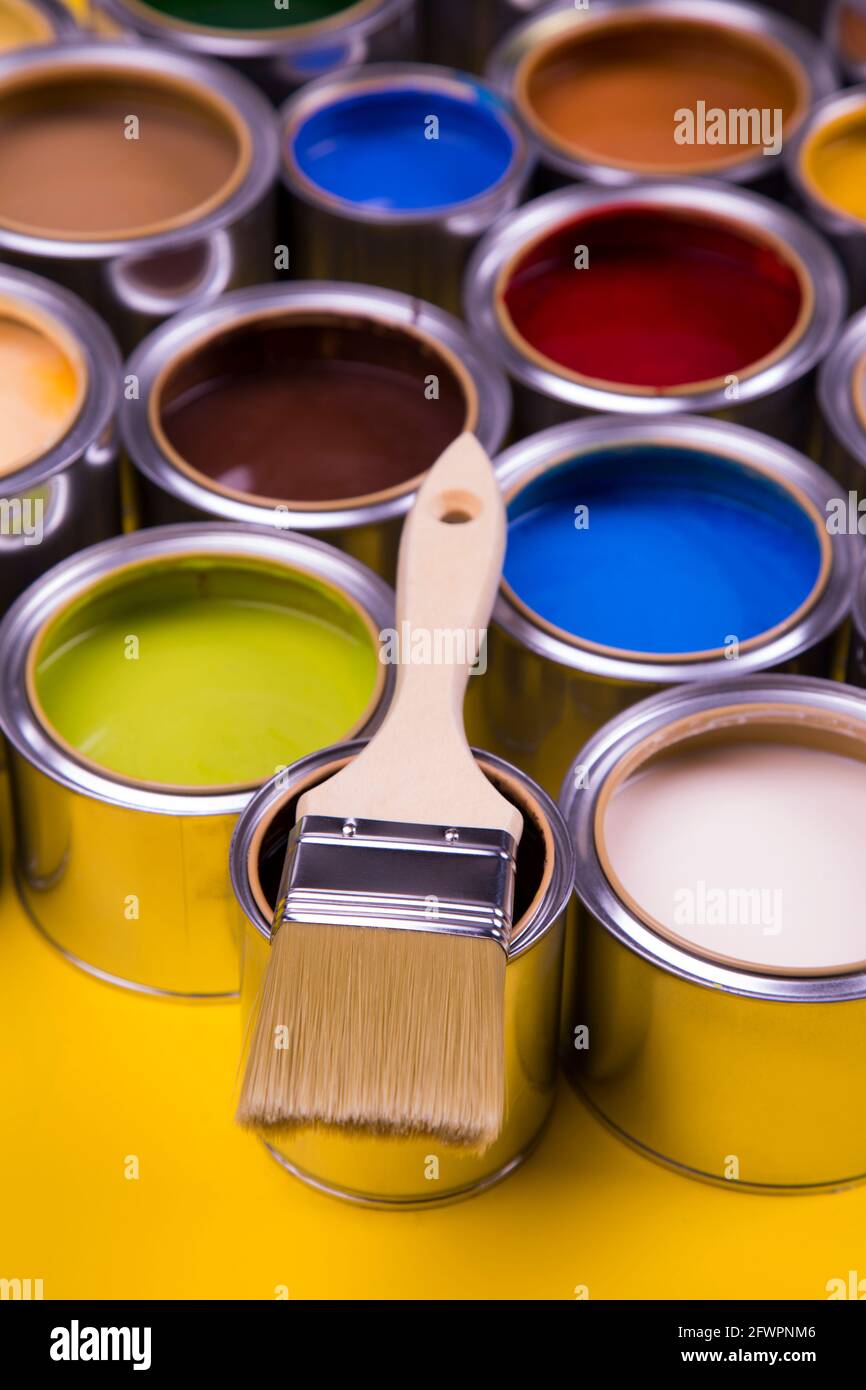 Metal tin cans with color paint and paintbrush Stock Photo - Alamy