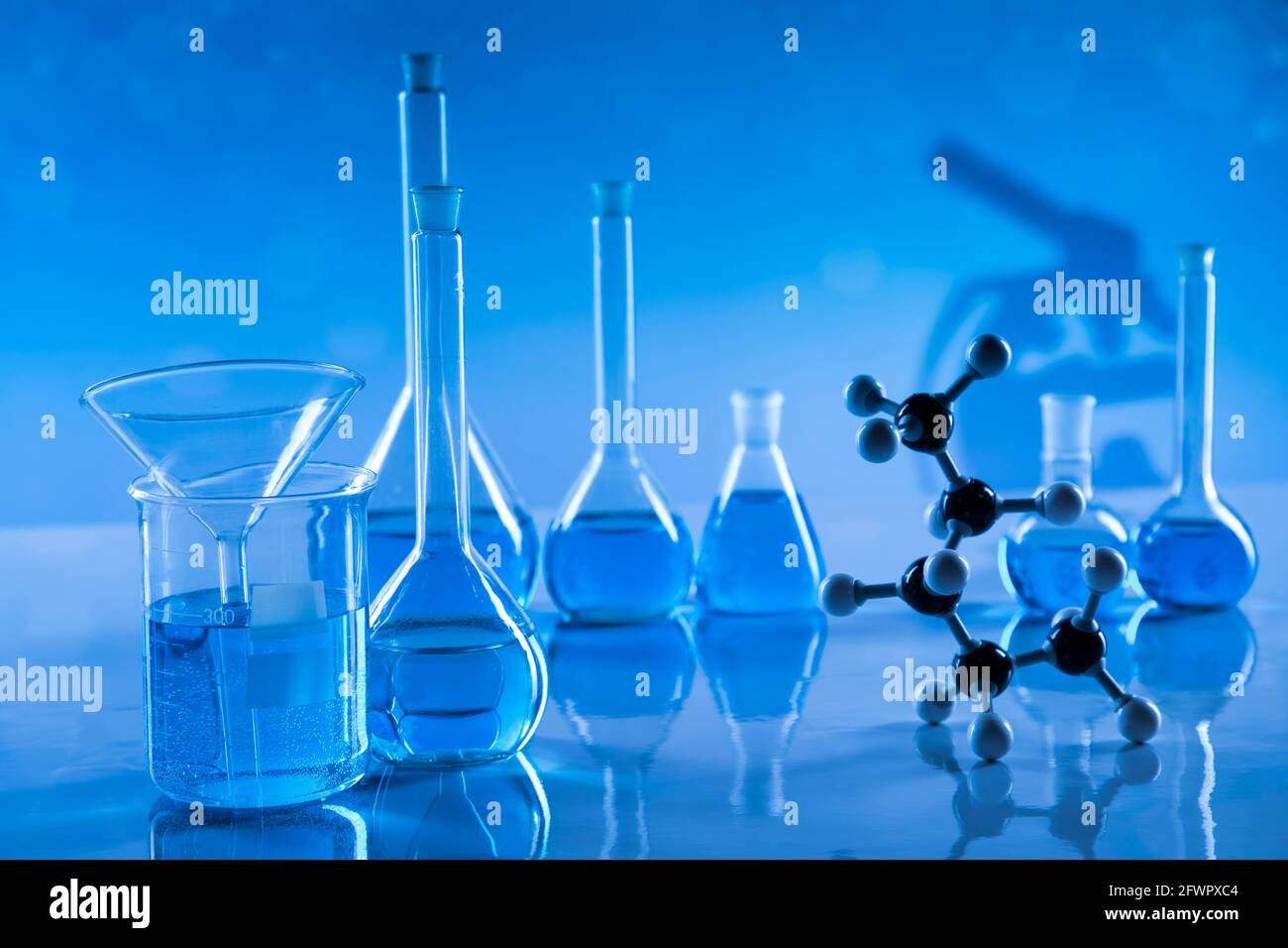 Laboratory equipment, glass filled background Stock Photo - Alamy