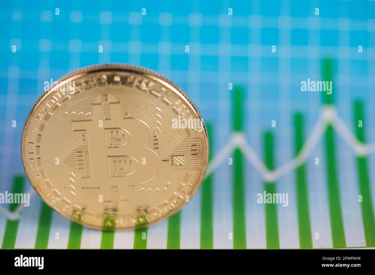 Gold Bitcoin on the background of the chart Stock Photo - Alamy