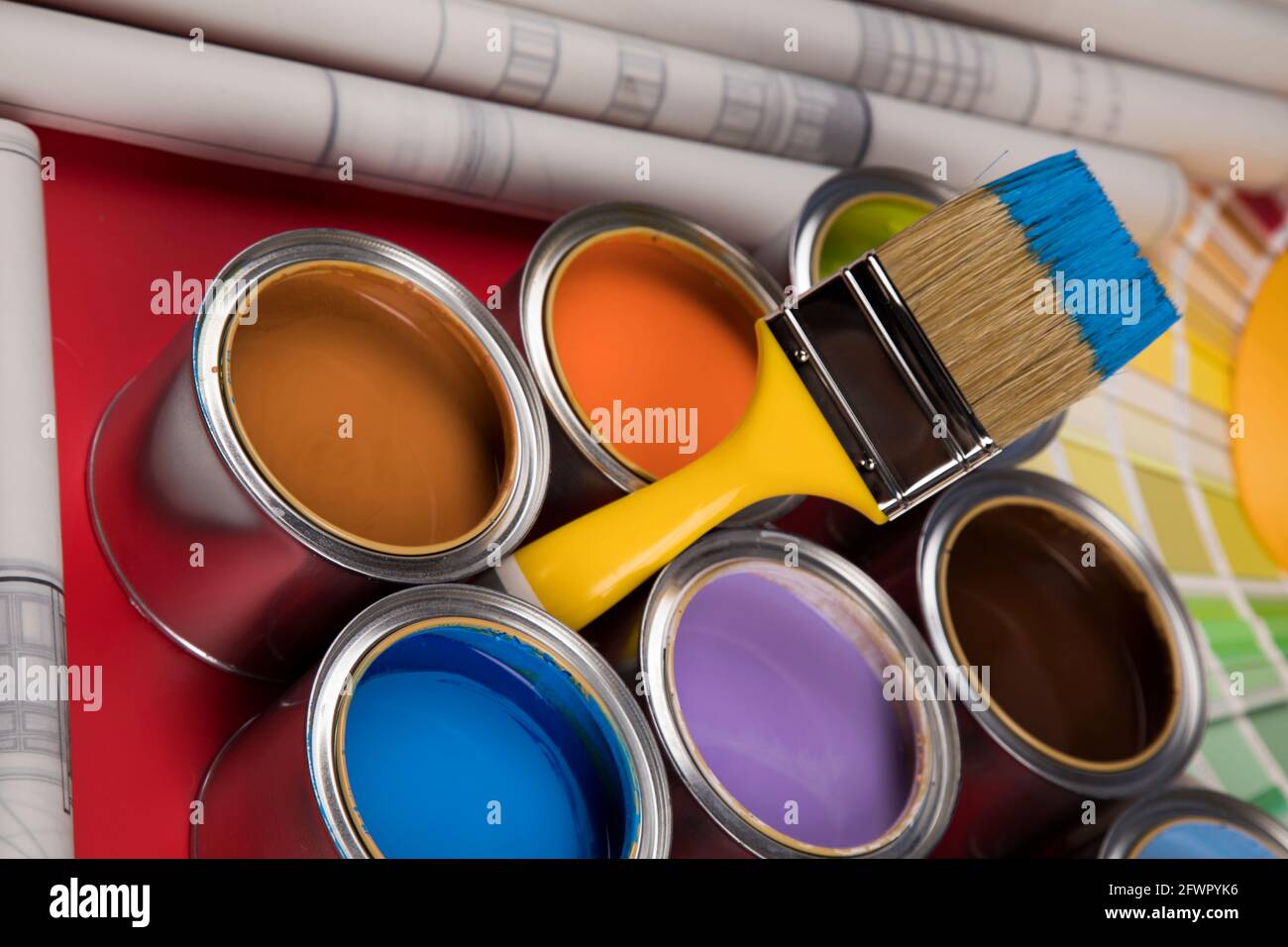 Paint brush, tin can and color guide samples Stock Photo - Alamy