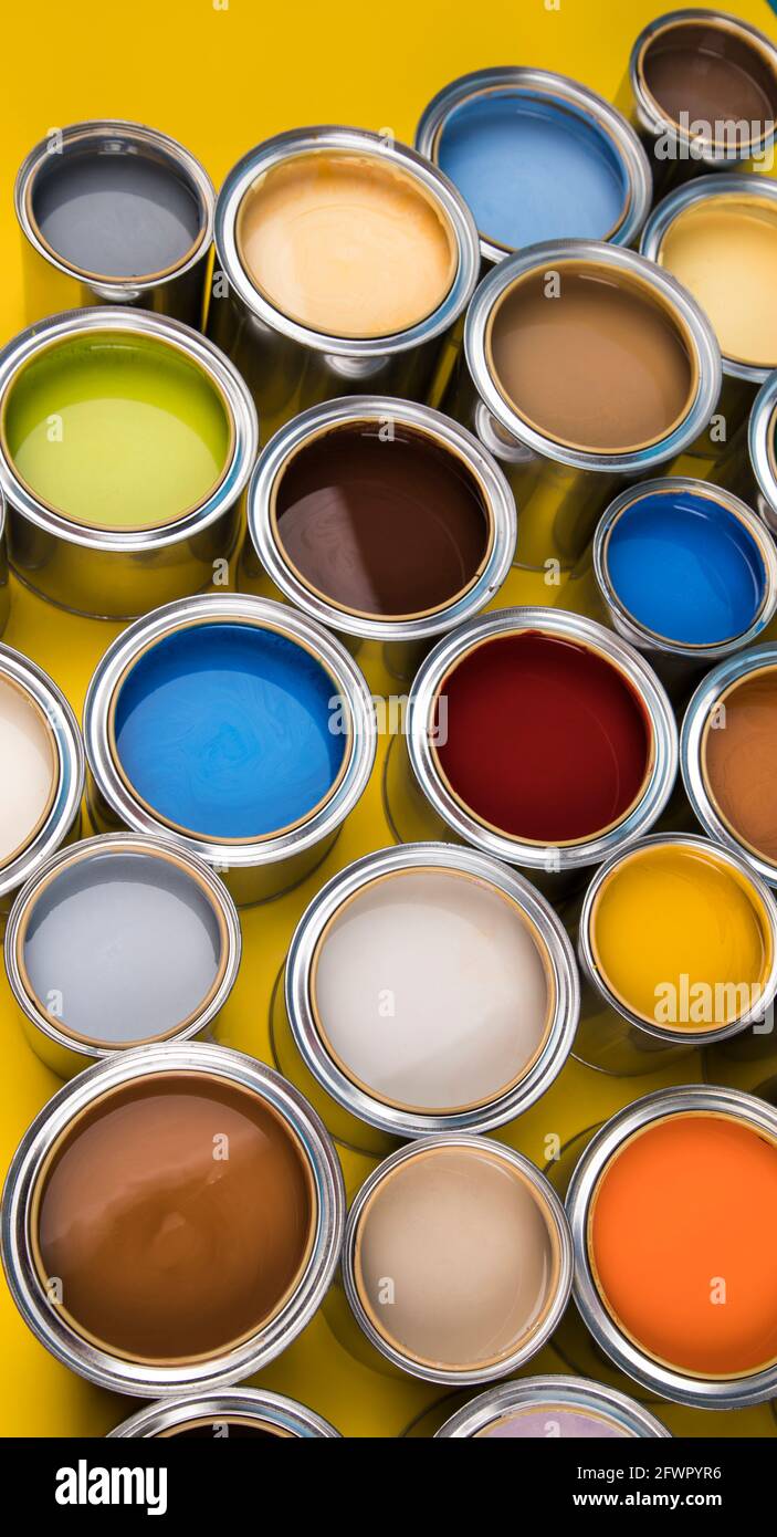 Group of tin metal cans with color paint Stock Photo - Alamy