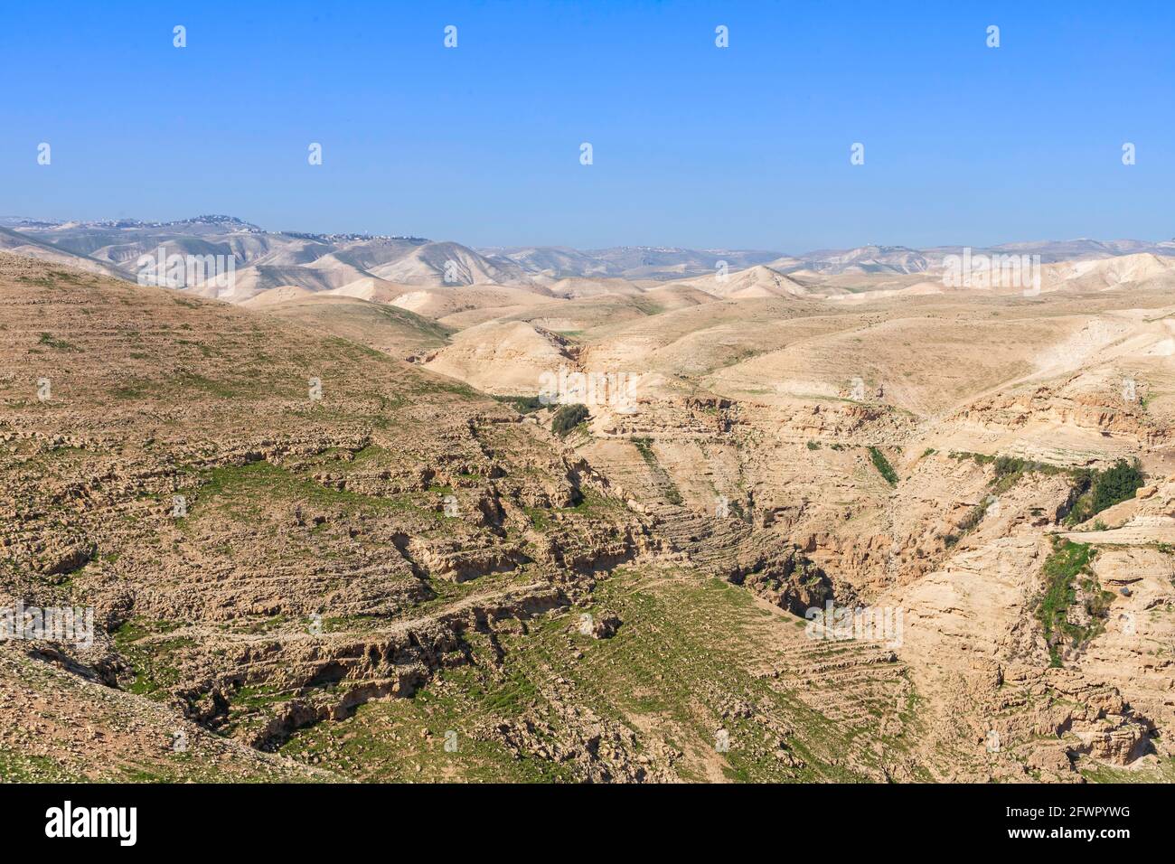 View of the slopes of the sandy mountains of the Judean Desert covered ...