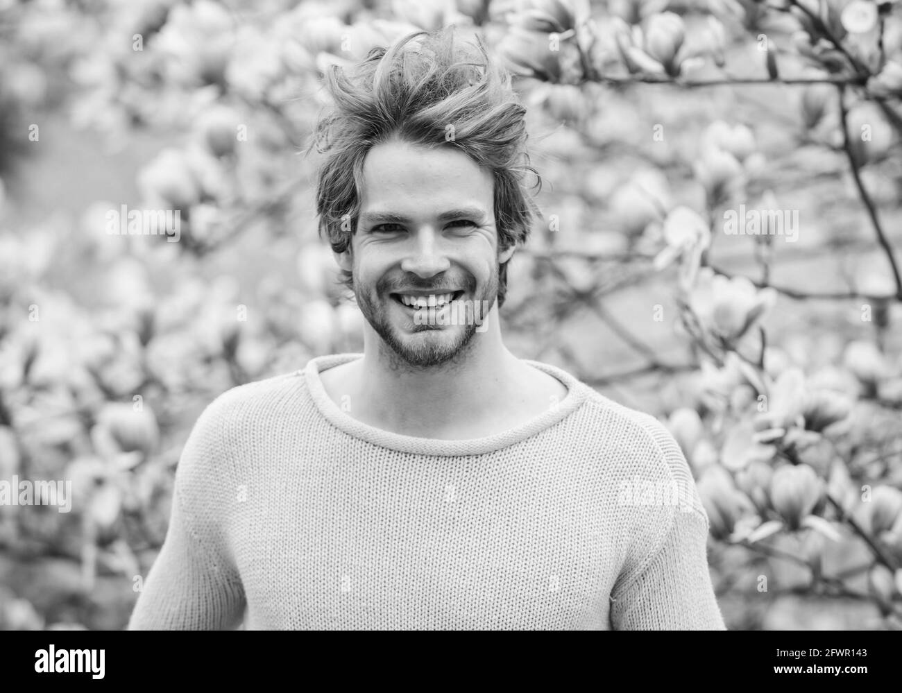 Springtime concept. Man flowers background defocused. Spring beauty ...