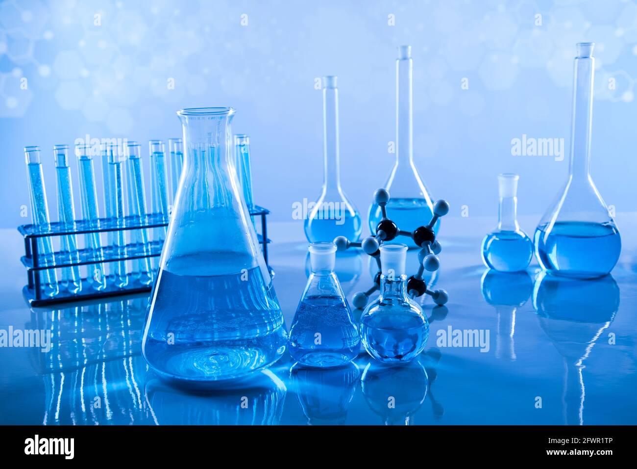 Laboratory beakers,Science experiment, blue background Stock Photo - Alamy