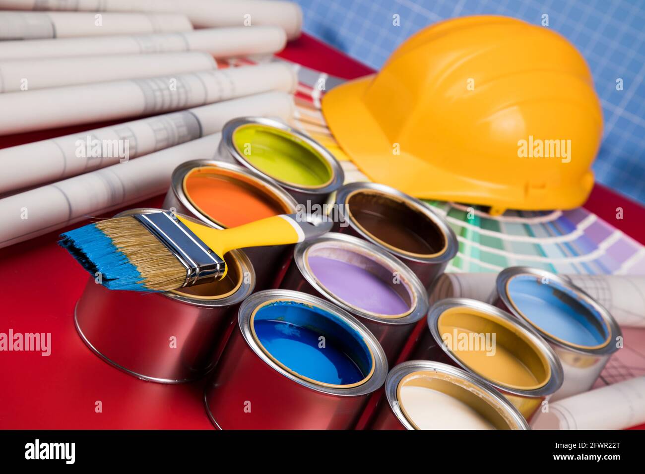 Paint brush, tin can and color guide samples Stock Photo - Alamy