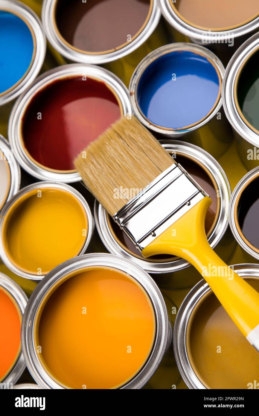Metal tin cans with color paint and paintbrush Stock Photo - Alamy
