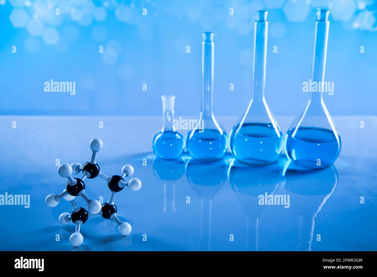Laboratory beakers,Science experiment, blue background Stock Photo - Alamy
