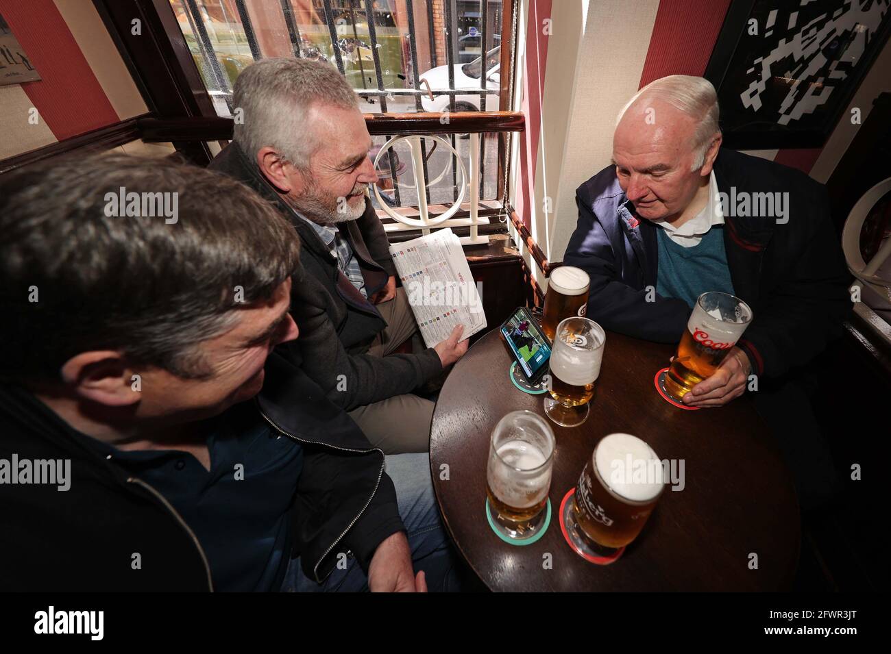 Joe Rainey (left) with his brother Larry Rainey (centre) having drinks ...