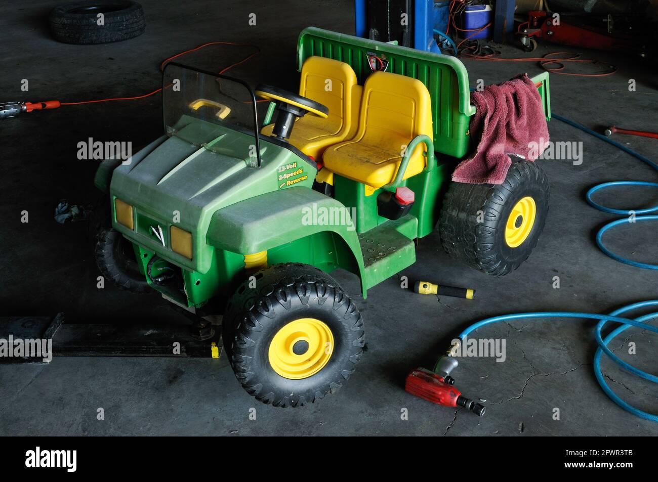 Kids playing at mechanics Stock Photo - Alamy