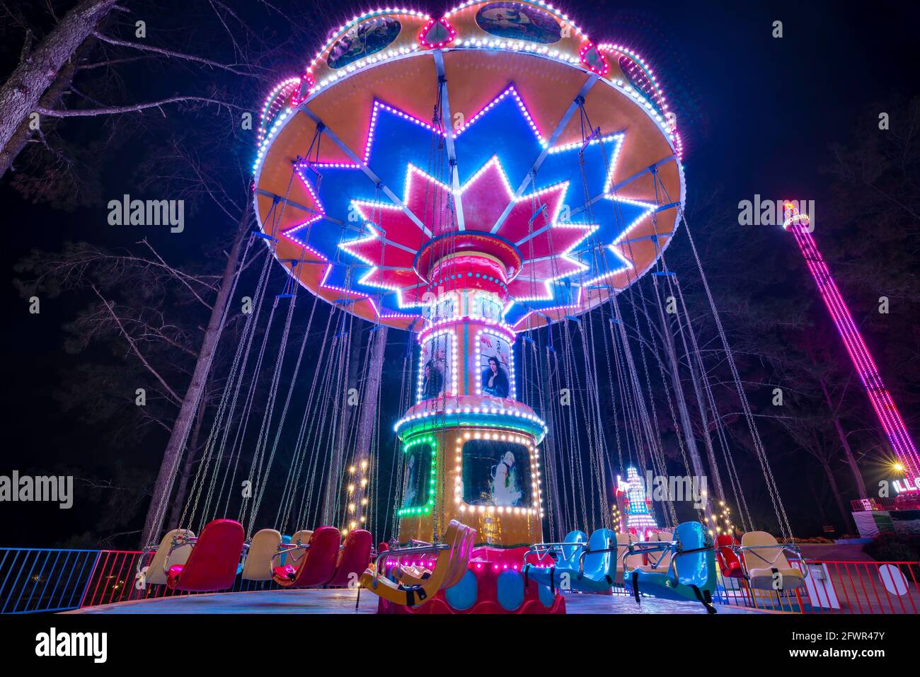 Swing ride at fair spinning around with people having fun Stock Photo ...