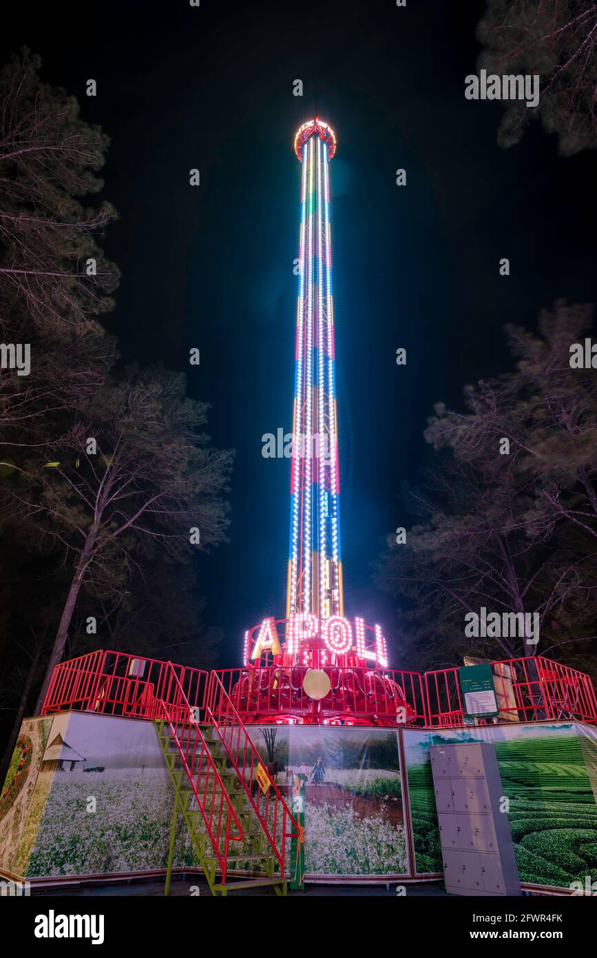 Swing ride at fair spinning around with people having fun Stock Photo ...