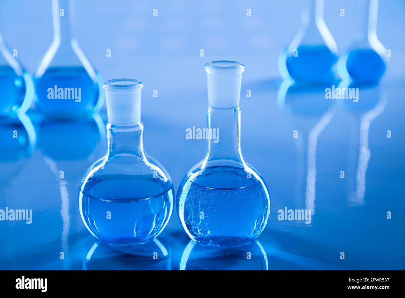 Laboratory equipment, glass filled background Stock Photo - Alamy