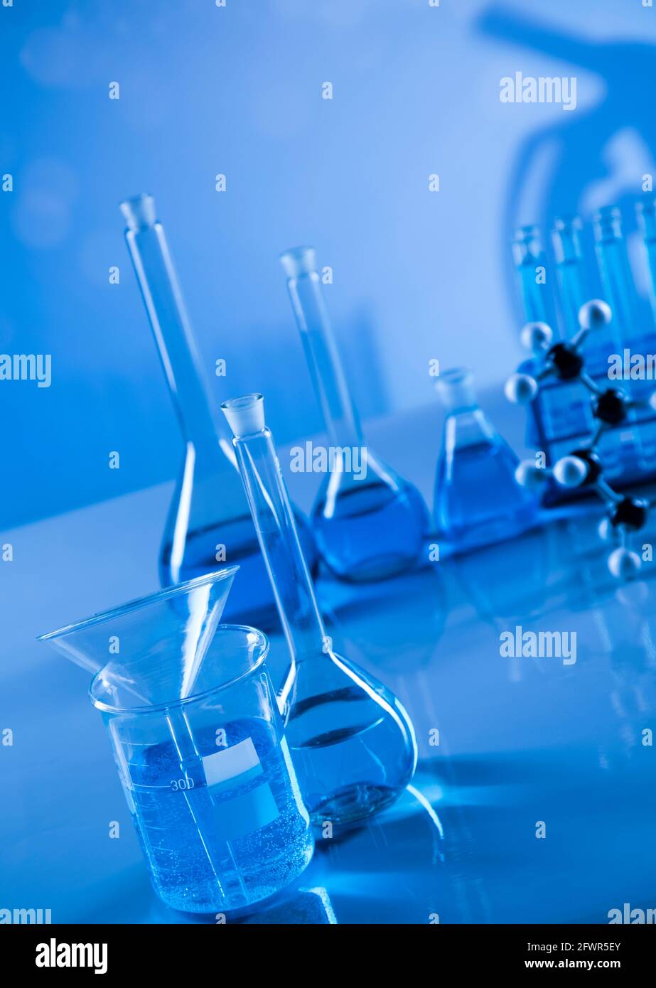 Laboratory equipment, glass filled background Stock Photo - Alamy
