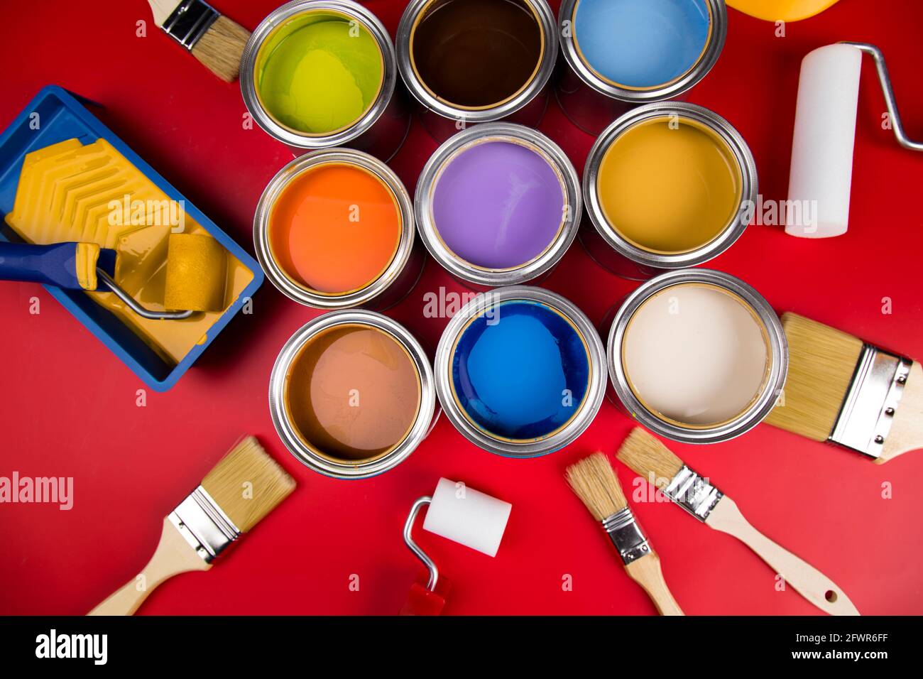 Paint brush, tin can and color guide samples Stock Photo - Alamy