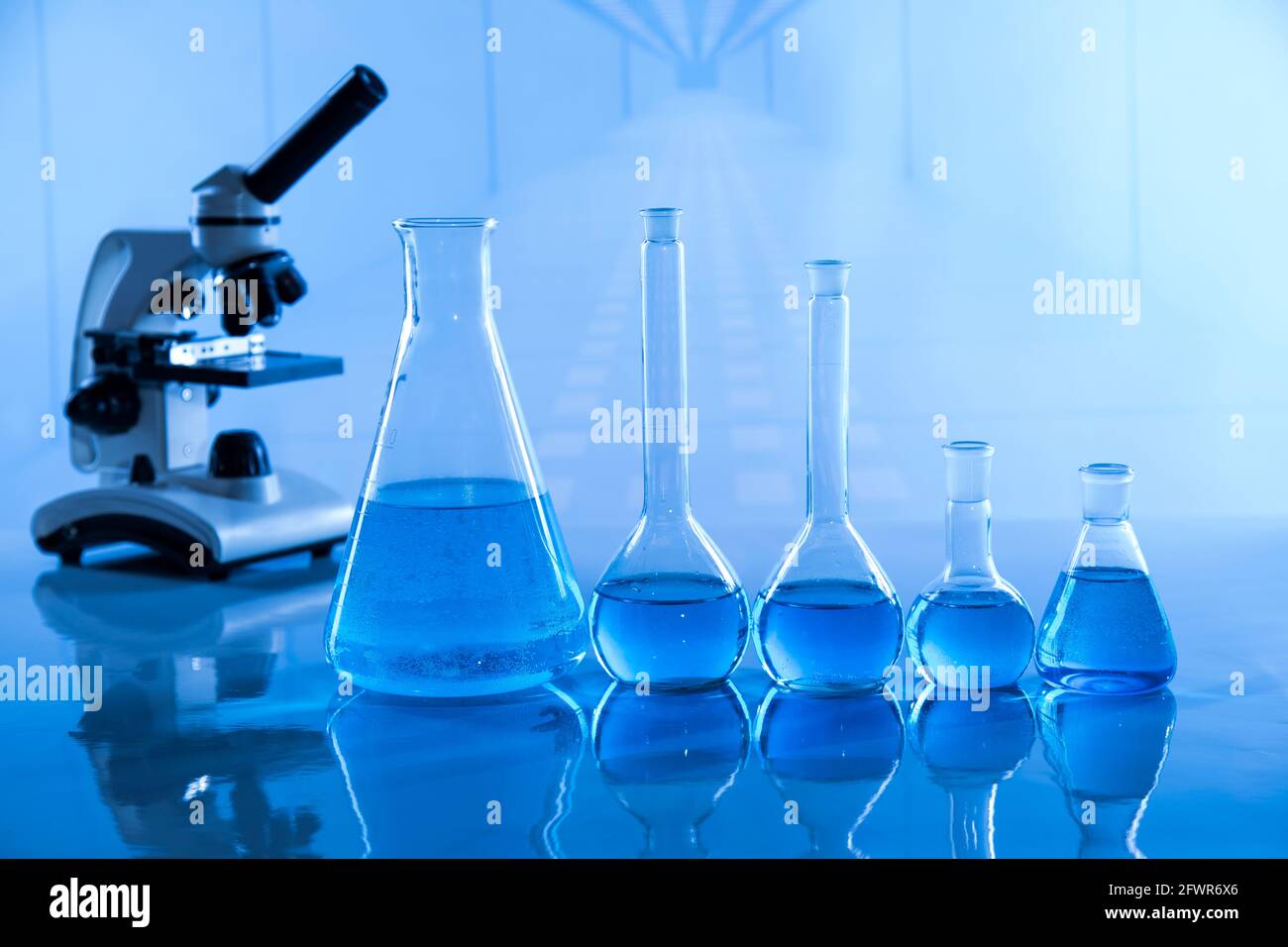 Laboratory equipment, glass filled background Stock Photo - Alamy