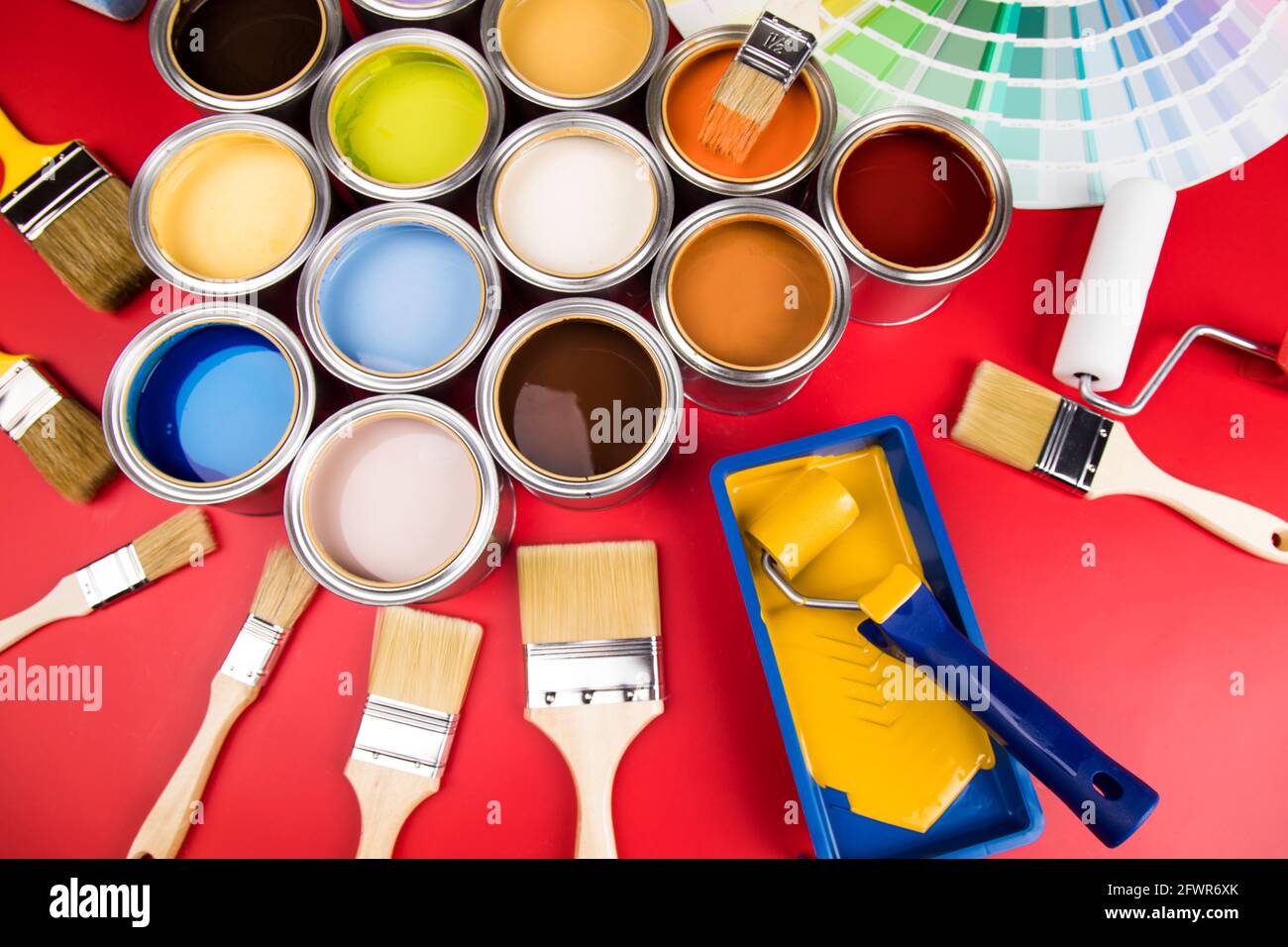 Paint brush, tin can and color guide samples Stock Photo - Alamy