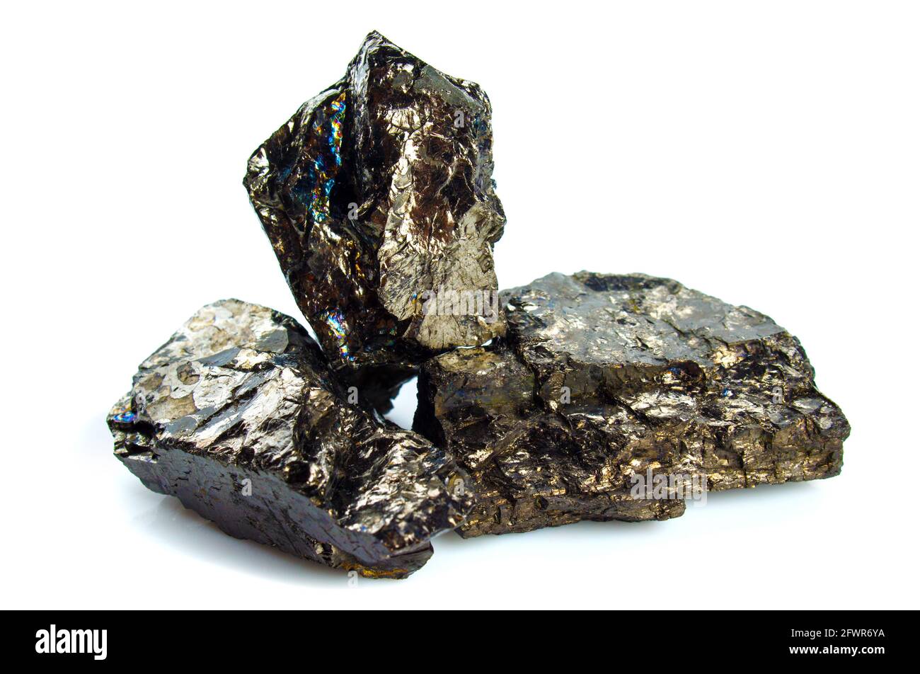 Fossil coal mined from the bowels of the earth on a white background ...