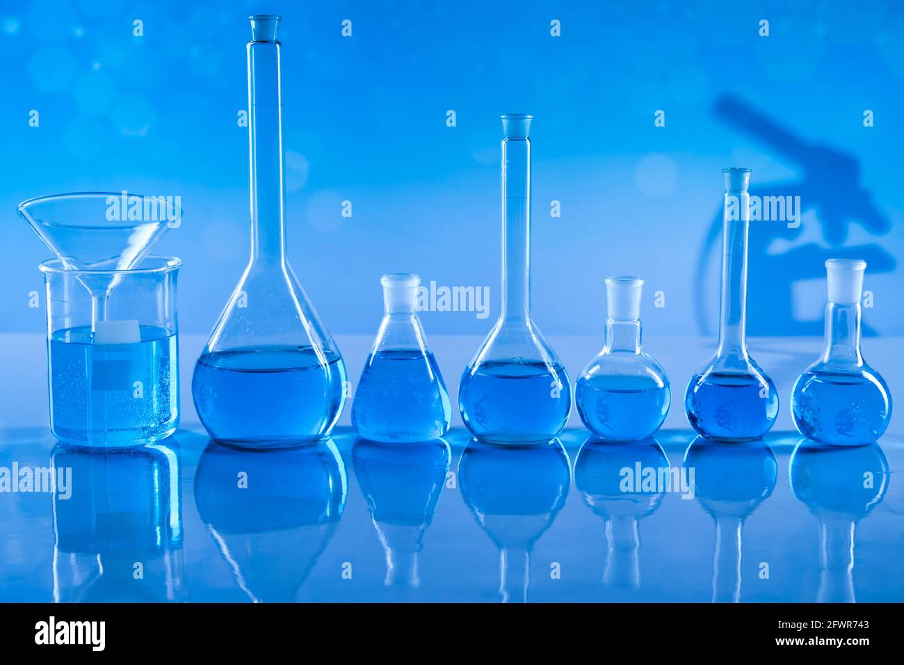 Laboratory equipment, glass filled background Stock Photo - Alamy