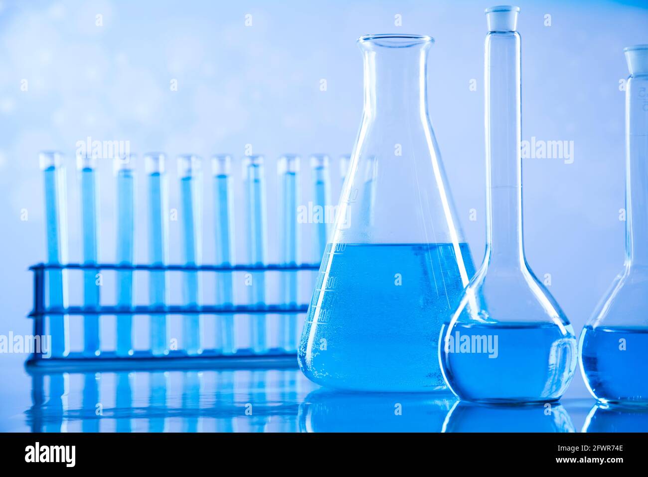 Laboratory equipment, glass filled background Stock Photo - Alamy