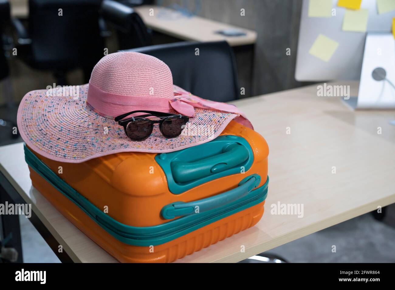 Getting ready bags and hats for the vacation Stock Photo - Alamy