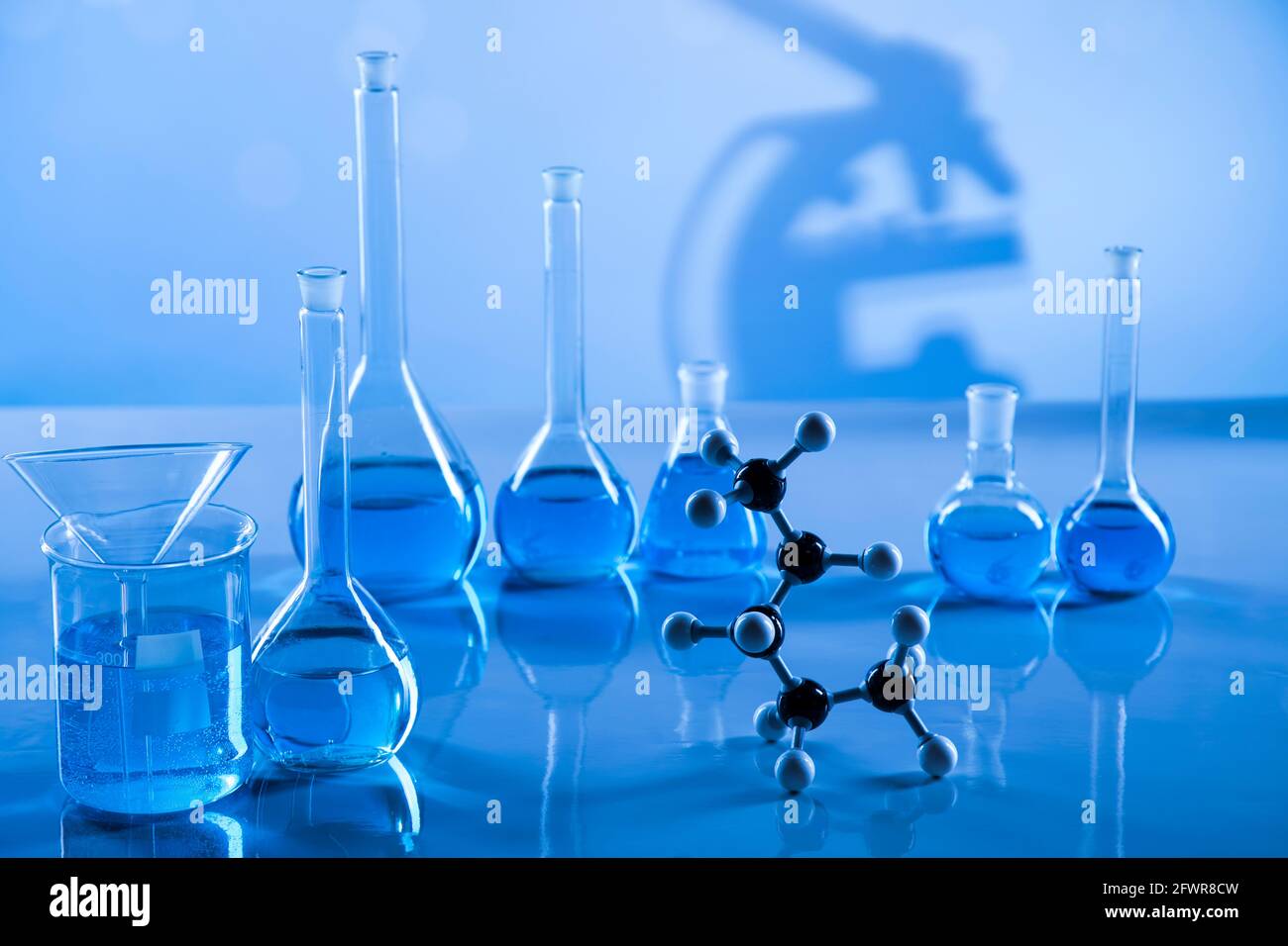 Laboratory equipment, glass filled background Stock Photo - Alamy