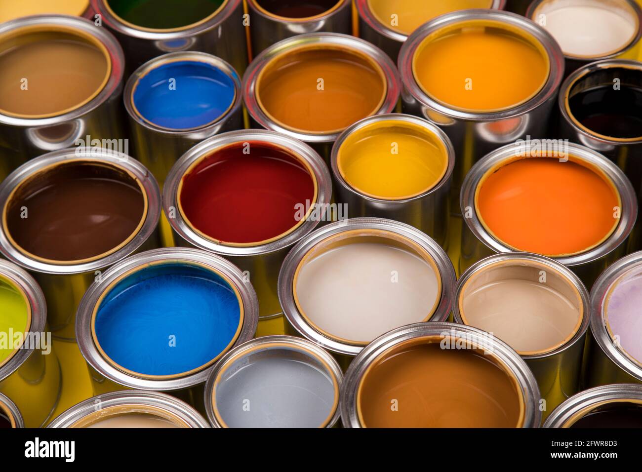 Group of tin metal cans with color paint Stock Photo - Alamy