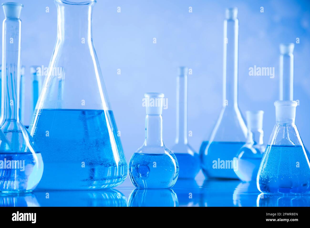 Laboratory equipment, glass filled background Stock Photo - Alamy