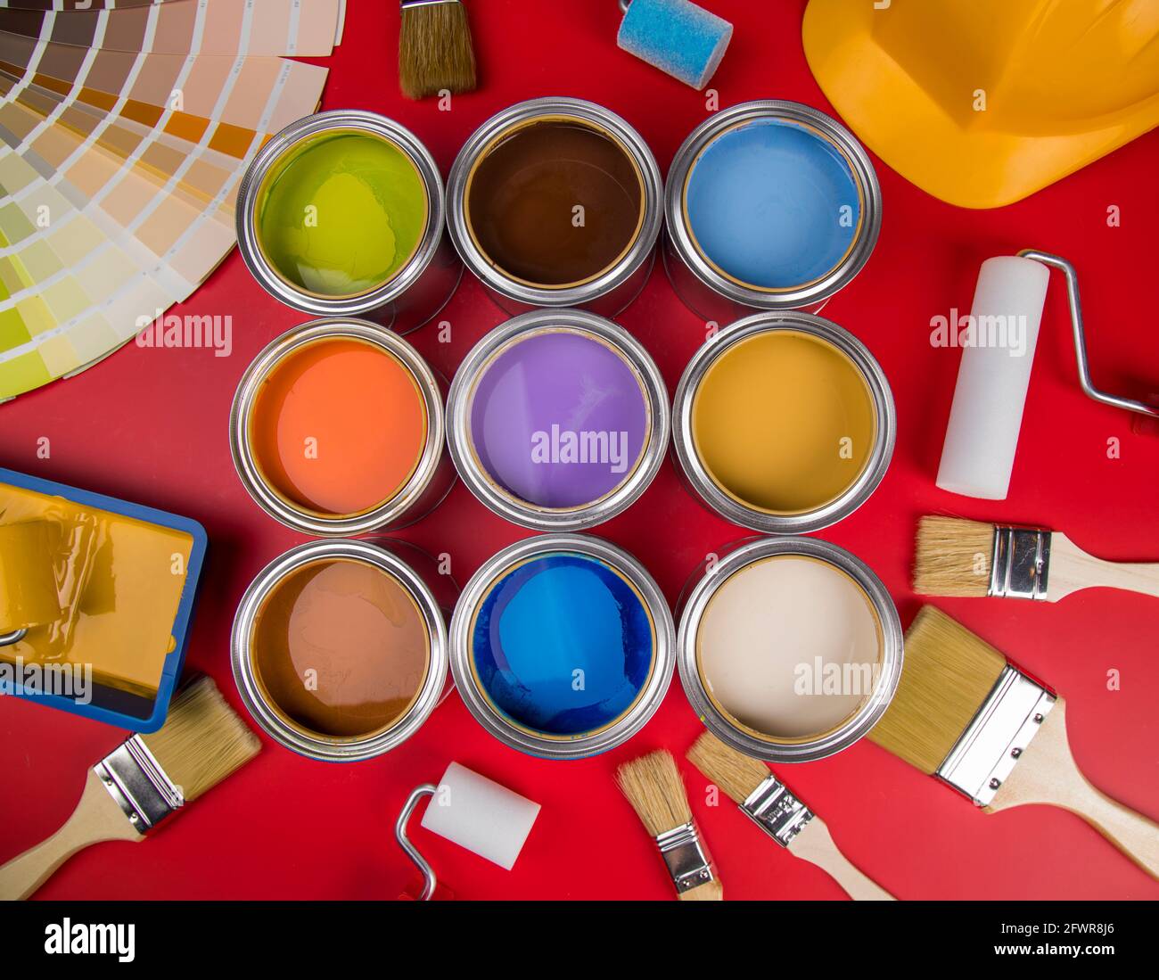 Paint brush, tin can and color guide samples Stock Photo - Alamy
