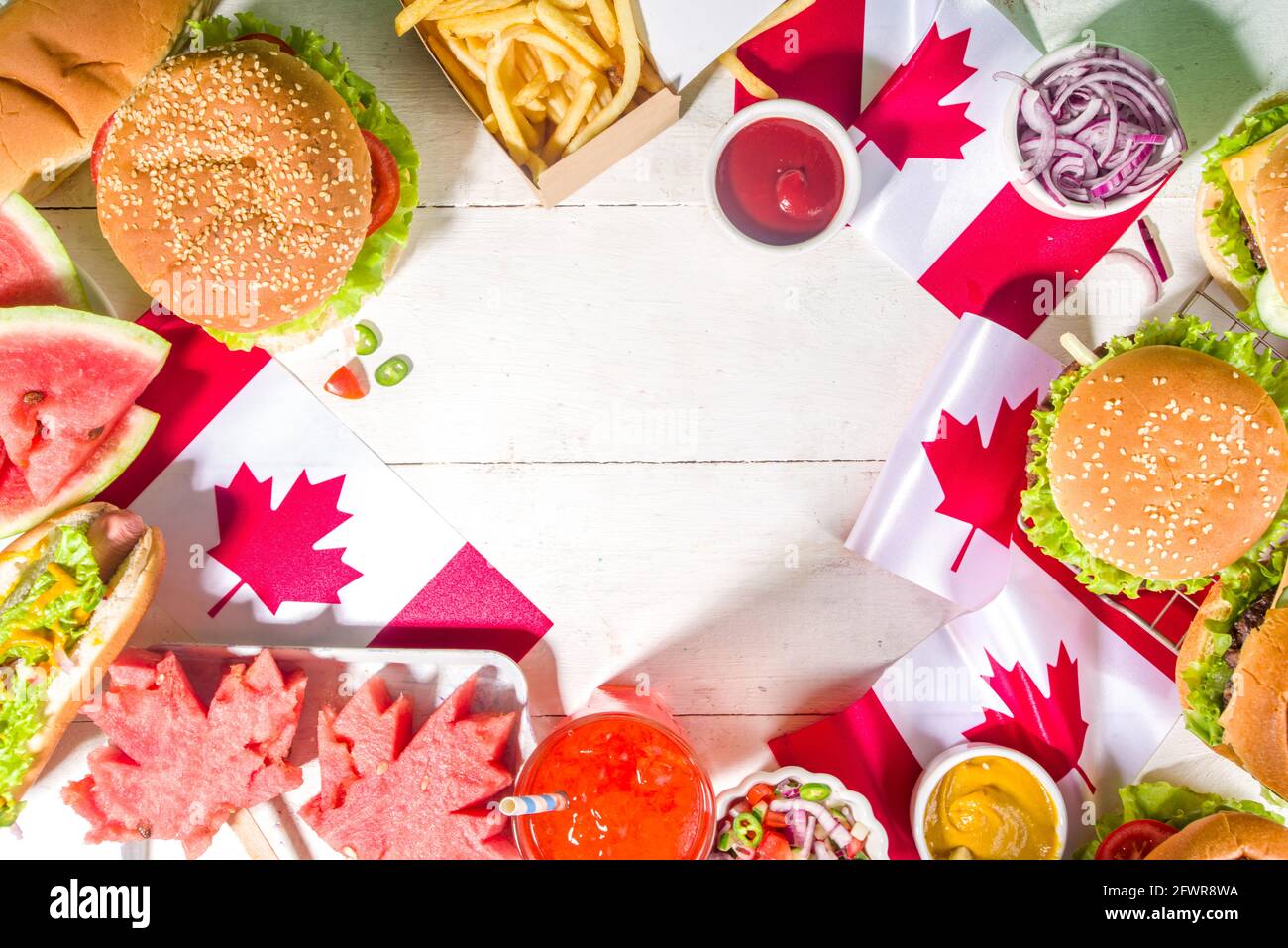 Set of various Canada Day bbq food. Picnic party table with maple leaf ...