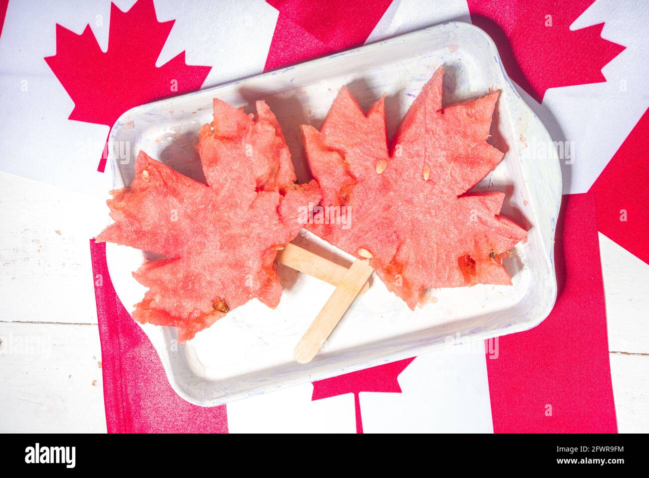 Canada Day concept, traditional maple leaf made from watermelon slices ...