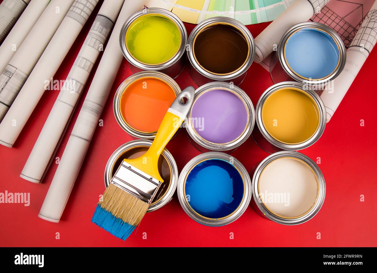 Paint brush, tin can and color guide samples Stock Photo - Alamy