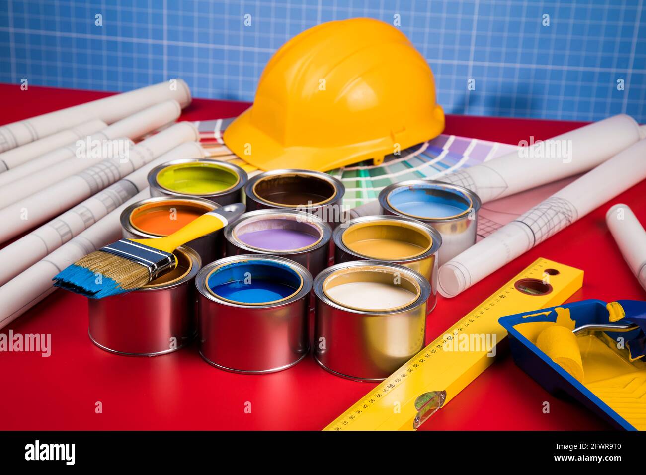 Paint brush, tin can and color guide samples Stock Photo - Alamy