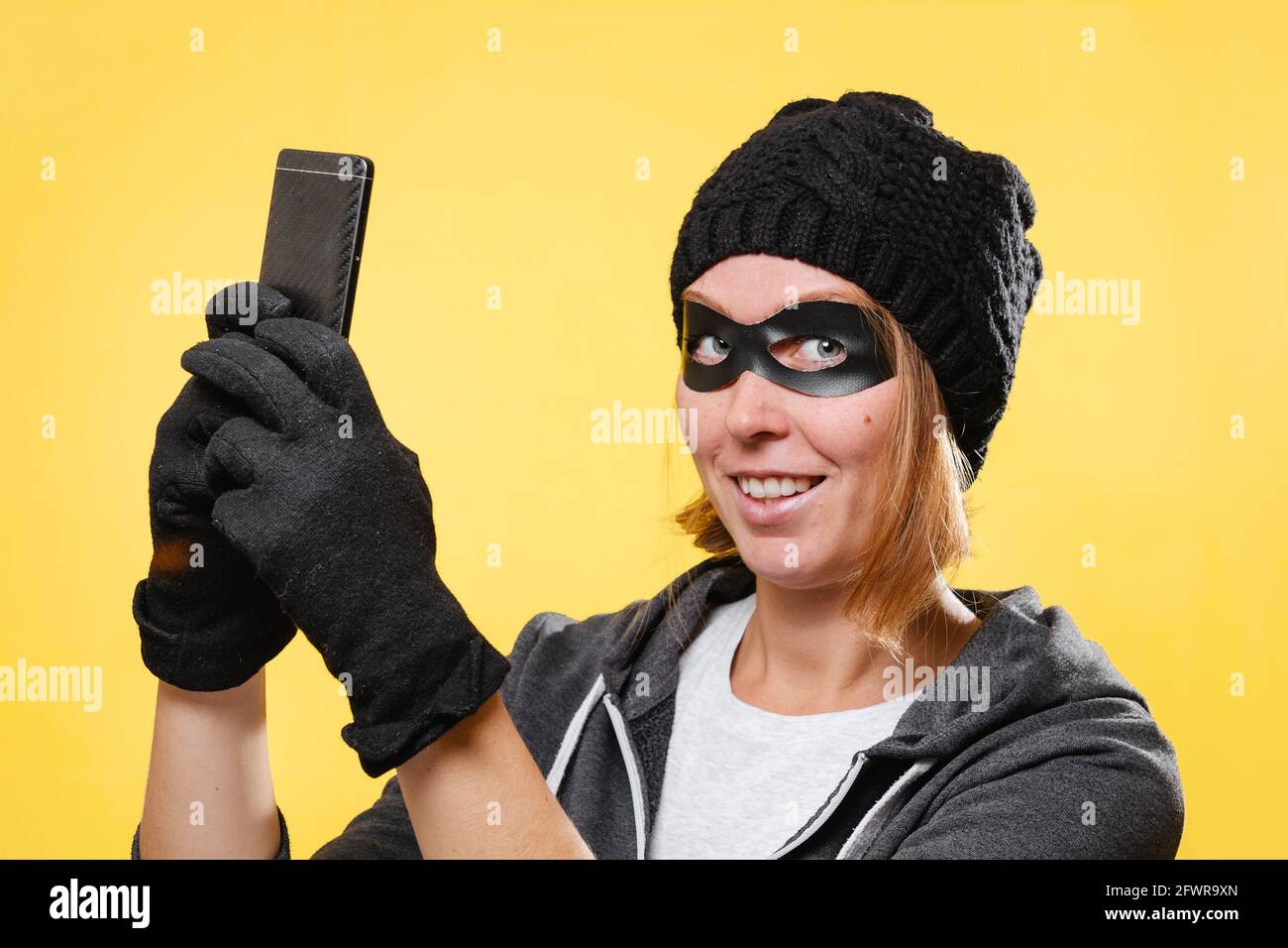 Female hacker in black mask hi-res stock photography and images - Alamy