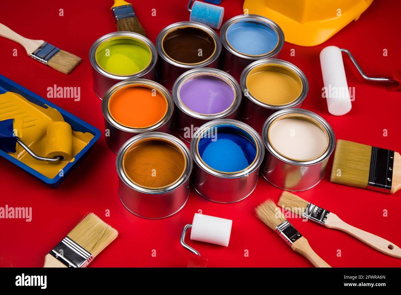 Paint brush, tin can and color guide samples Stock Photo - Alamy