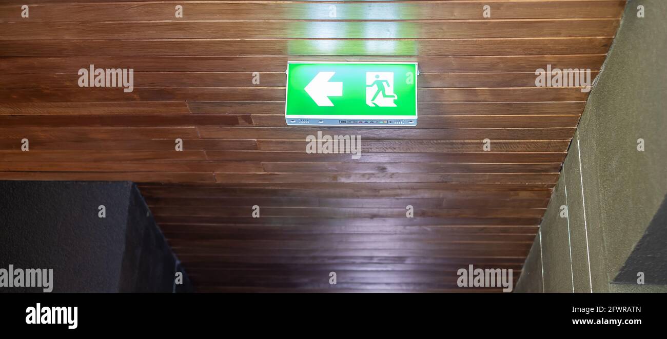Fire Emergency exit sign on the wall background inside building. Safety ...