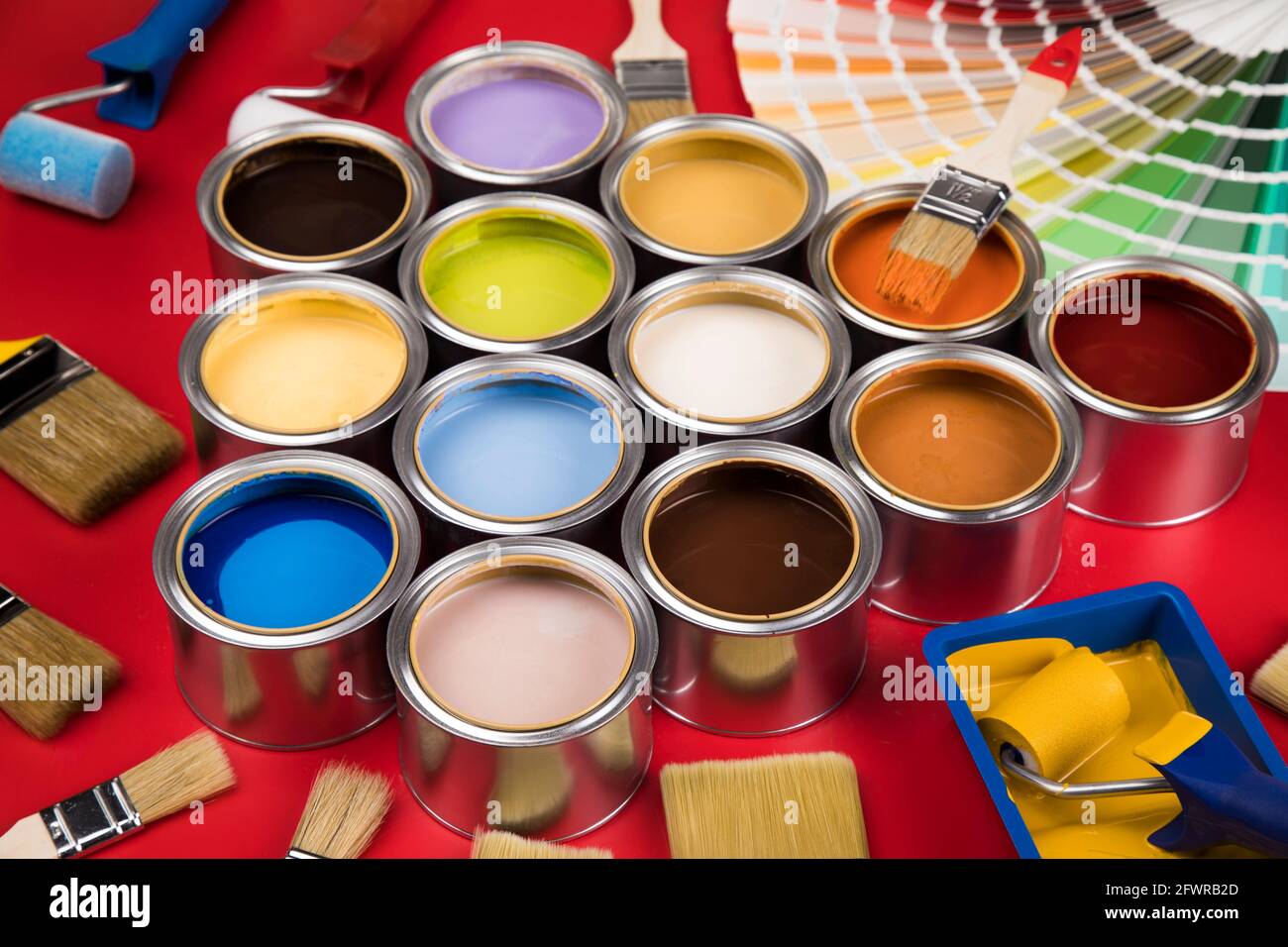 Paint brush, tin can and color guide samples Stock Photo - Alamy