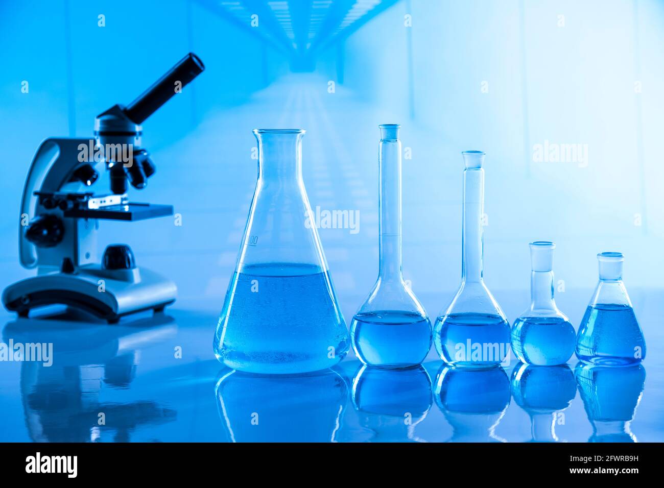 Laboratory equipment, glass filled background Stock Photo - Alamy